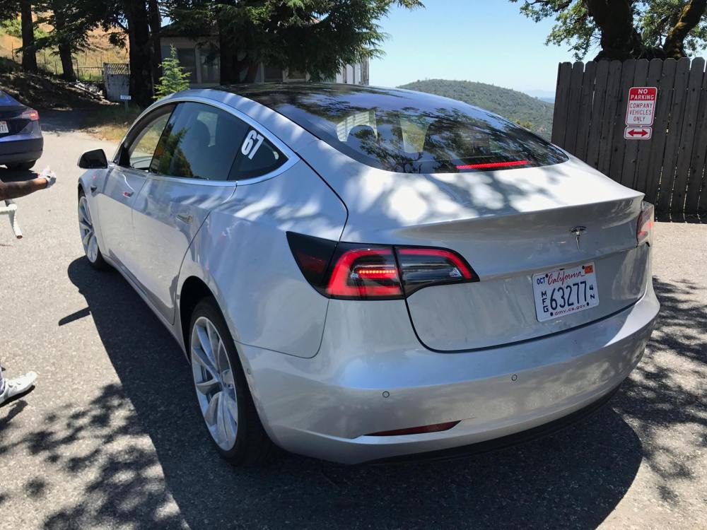 Tesla Model 3 rear three quarters left side spy shot