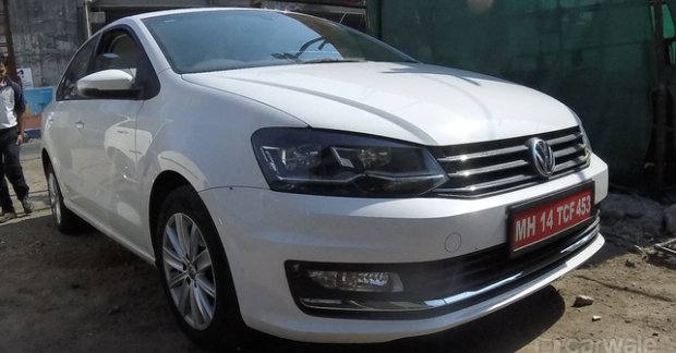 VW Vento with new headlight clusters spied up close